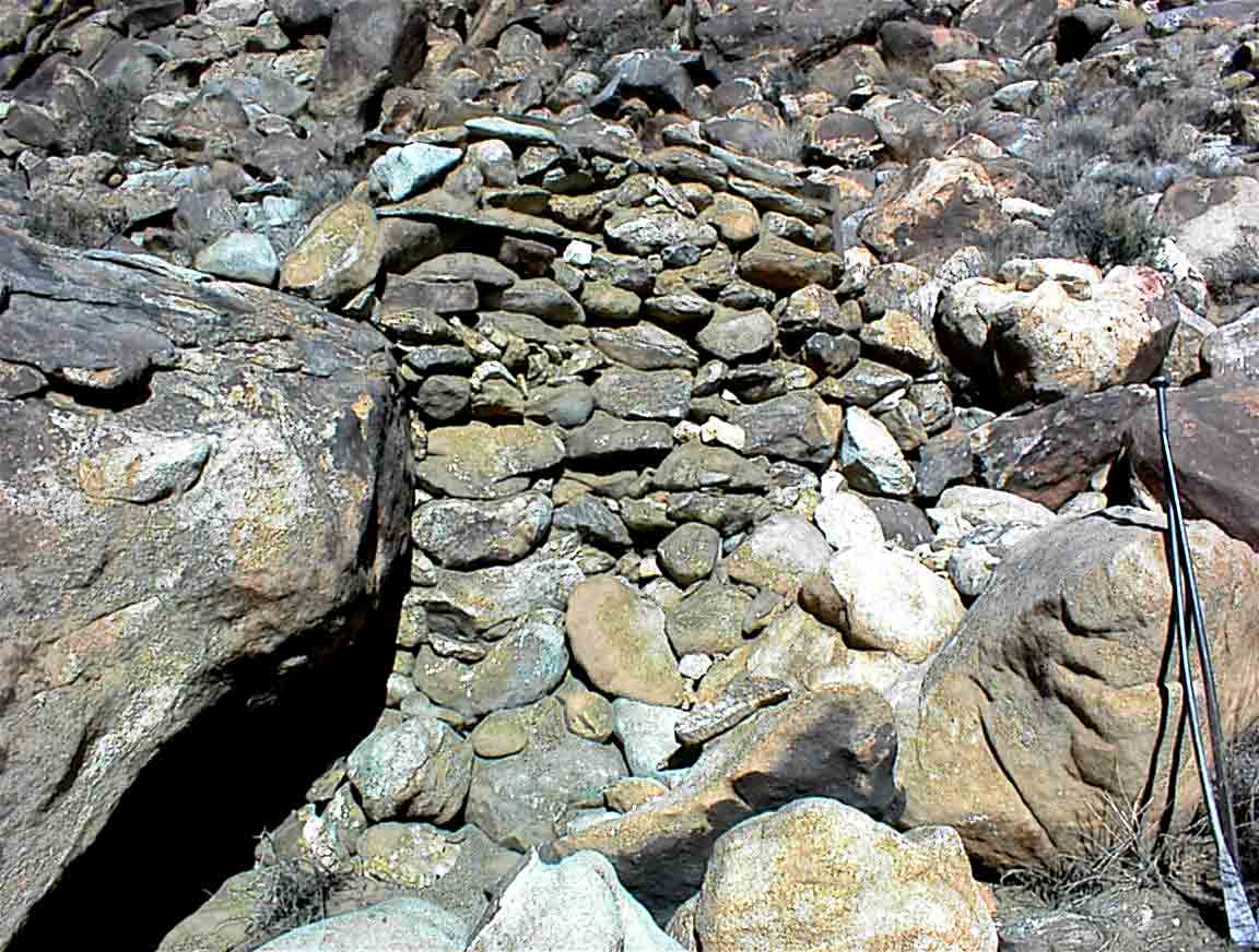 The water tub system is behind this stone wall